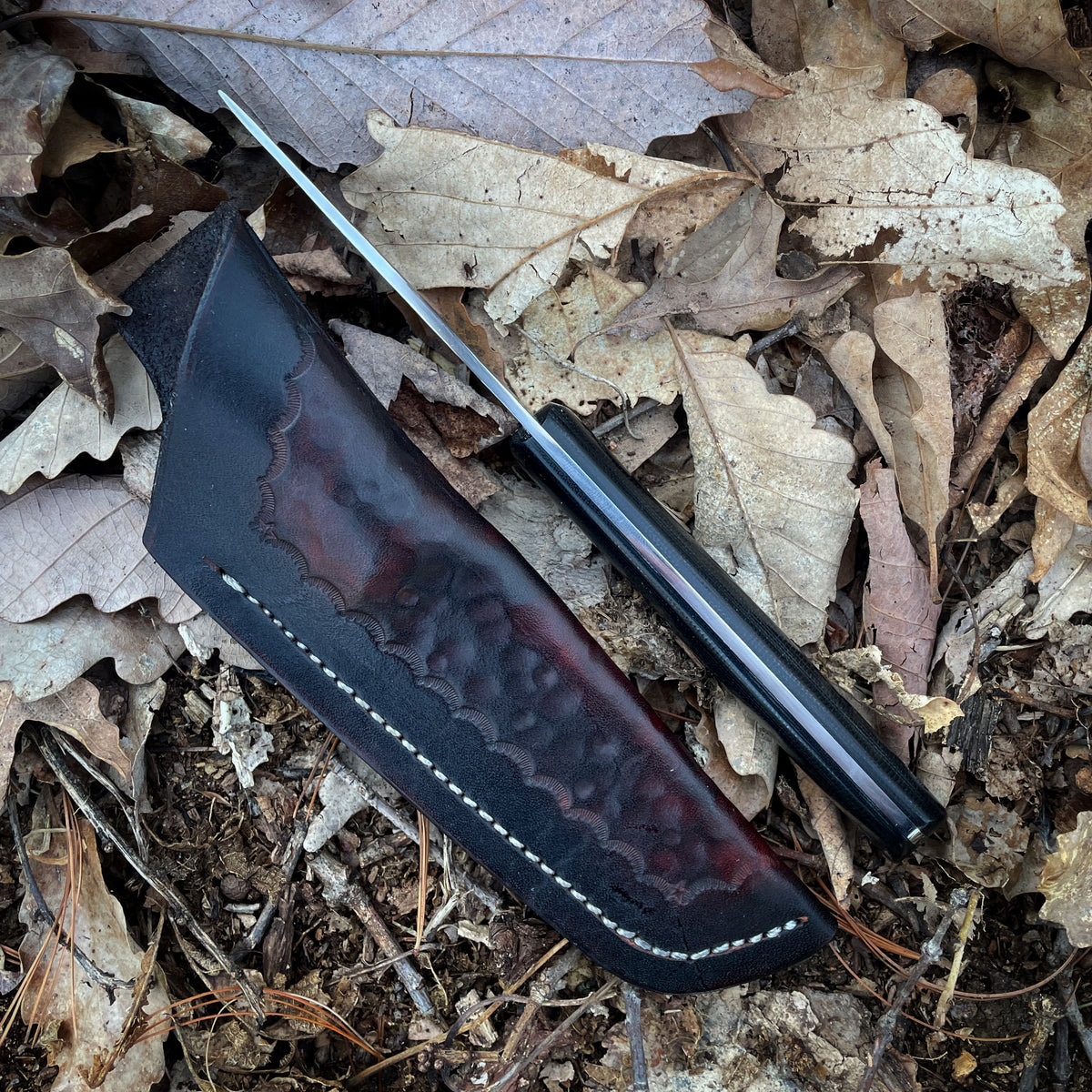 Trapper with Black Canvas Micarta scales – Wheelis Forge